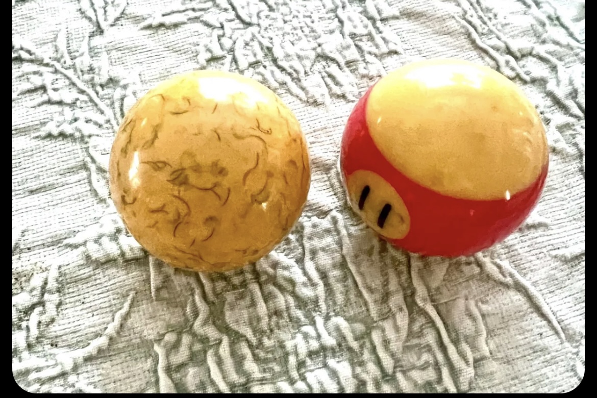 I need help identifying these billiard balls and what they are made of ...